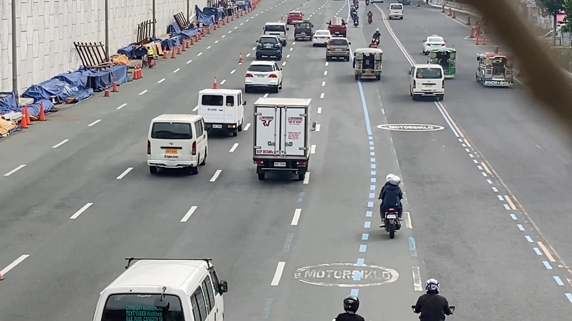 Motorcycle, Jeepneys, Cars, and Other Vehicles along the Commonwealth ...